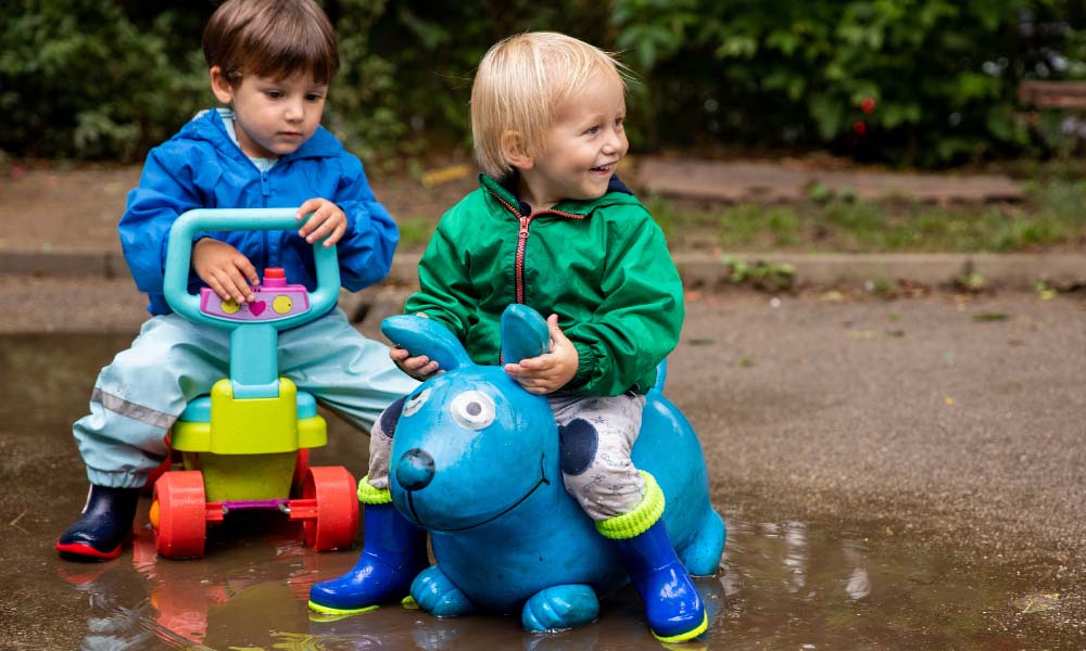 Kids Playing In The Rain